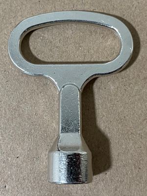Triangular key for opening ashtray and bin
